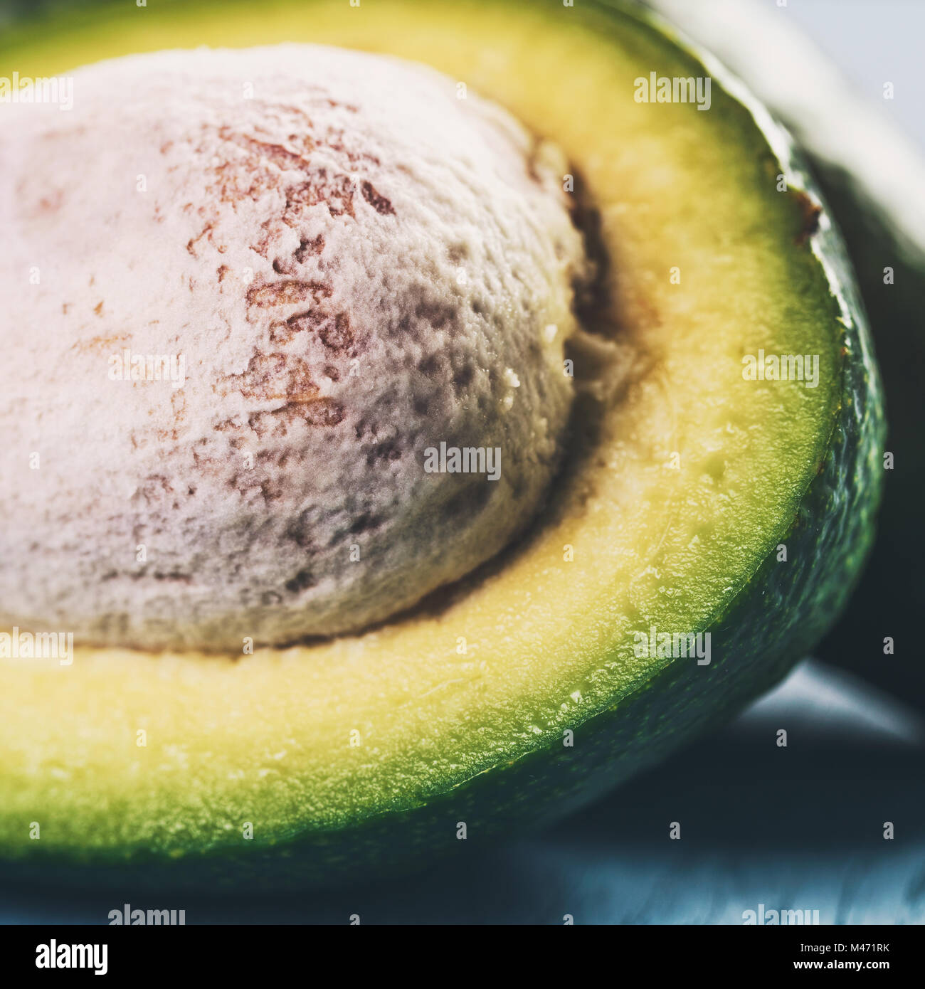 ripe green avocados on wood table Stock Photo - Alamy