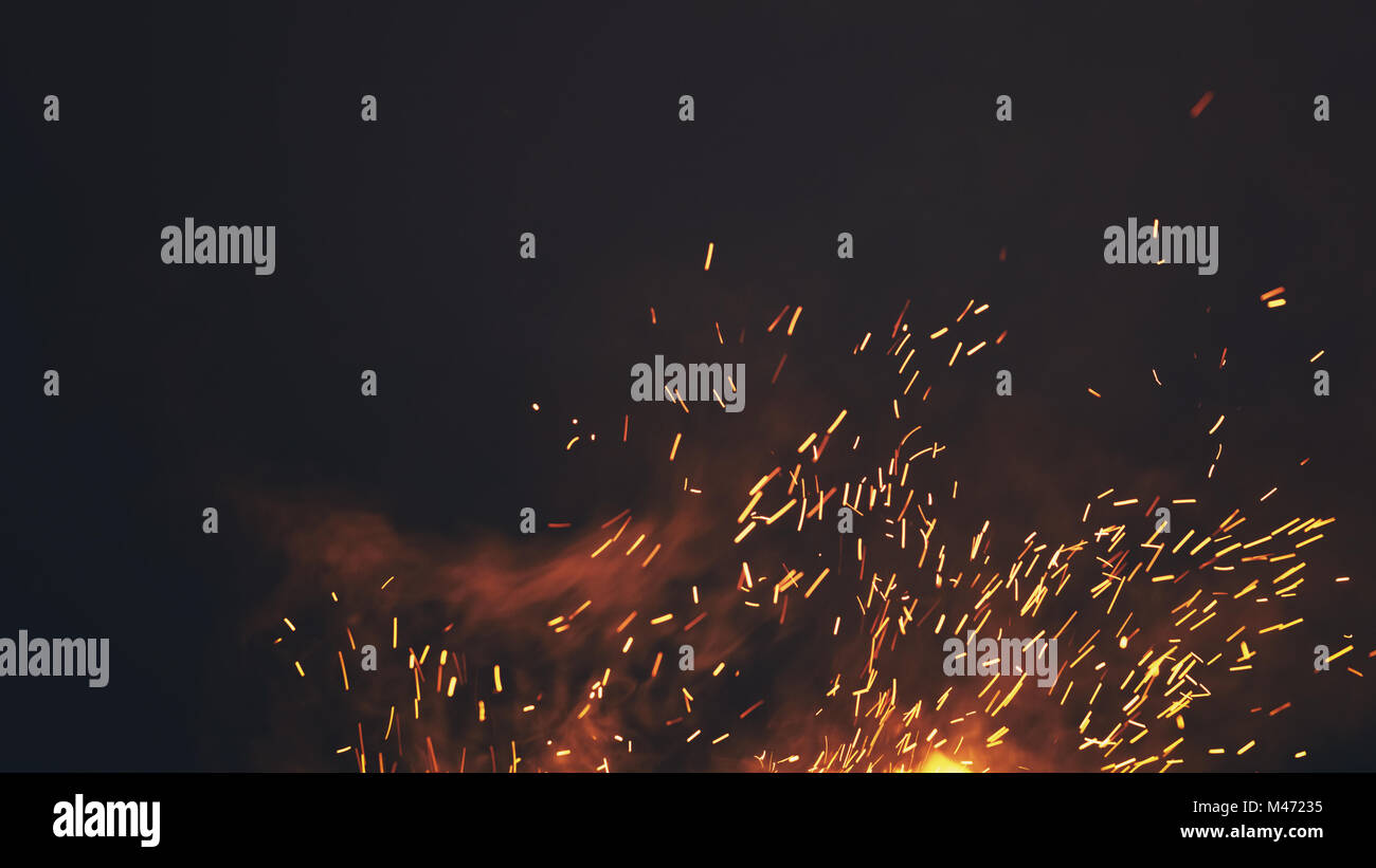 bonfire spark in the dark sky in night Stock Photo - Alamy
