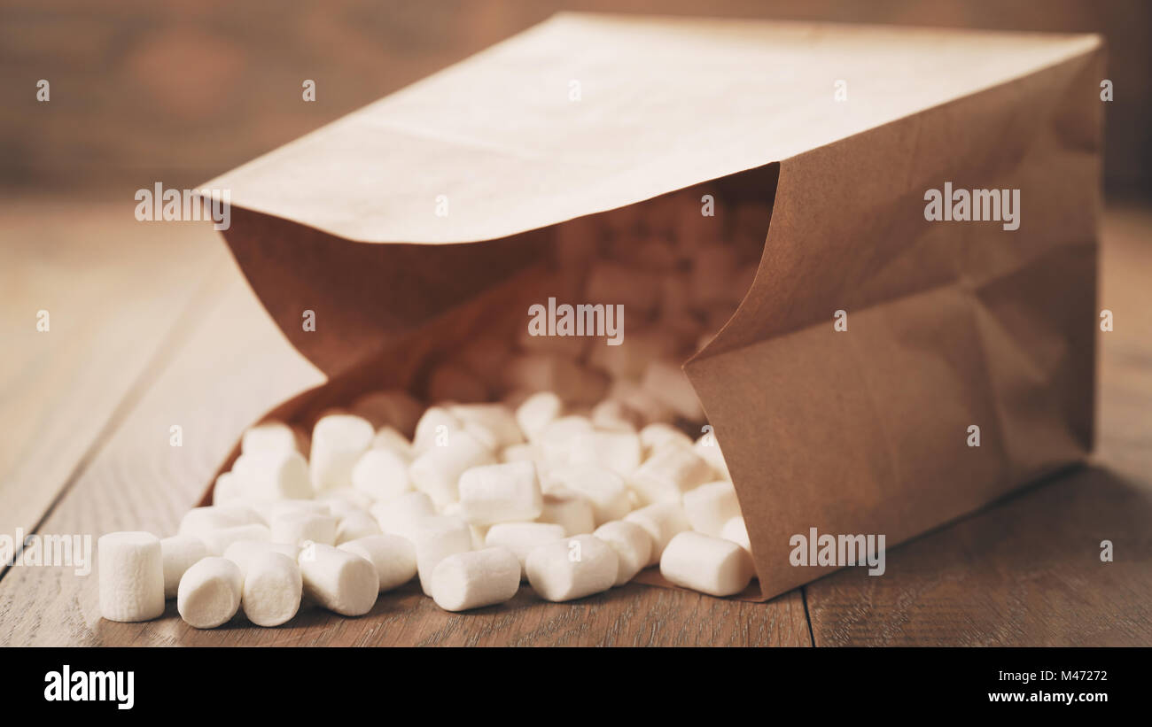 marshmallow in brown craft paper bag on wooden table Stock Photo - Alamy