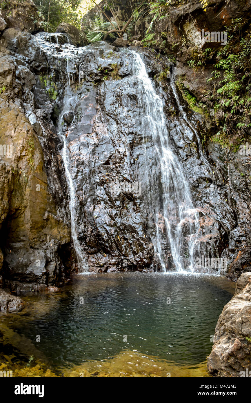 lonely waterfall in tropical cliff landscape with clear water Stock ...