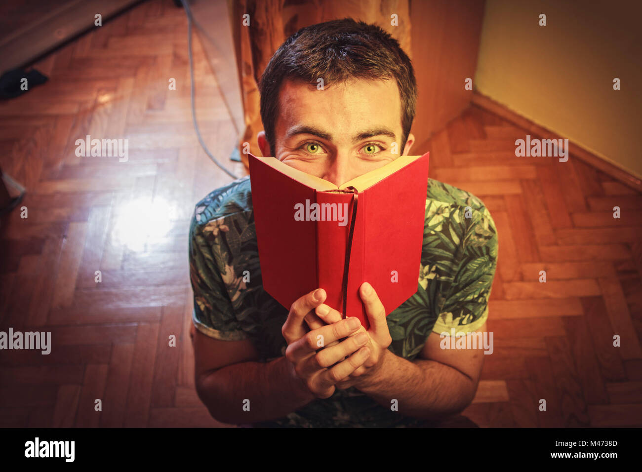 Young man loves to read books Stock Photo - Alamy