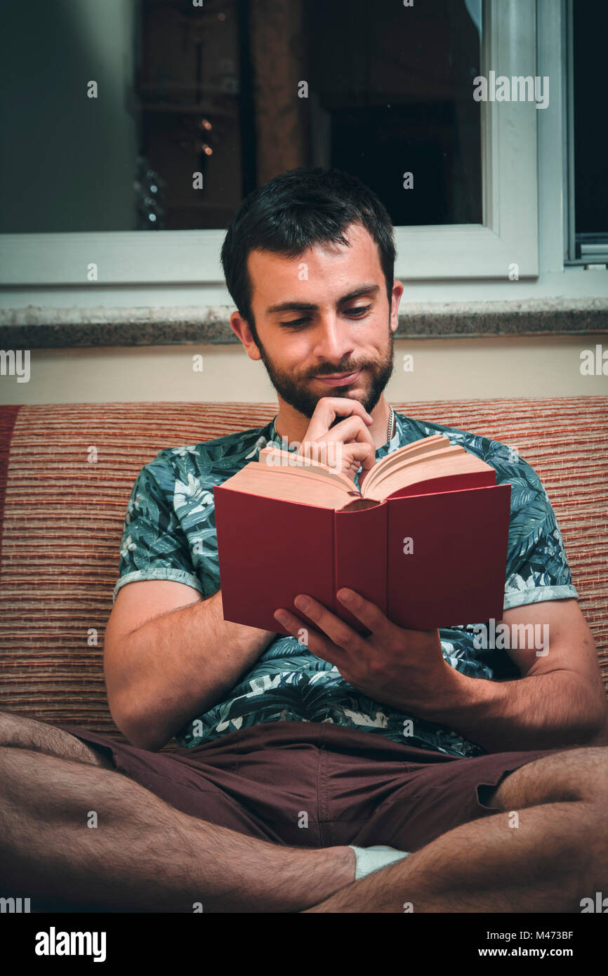 Reading a great book Stock Photo - Alamy