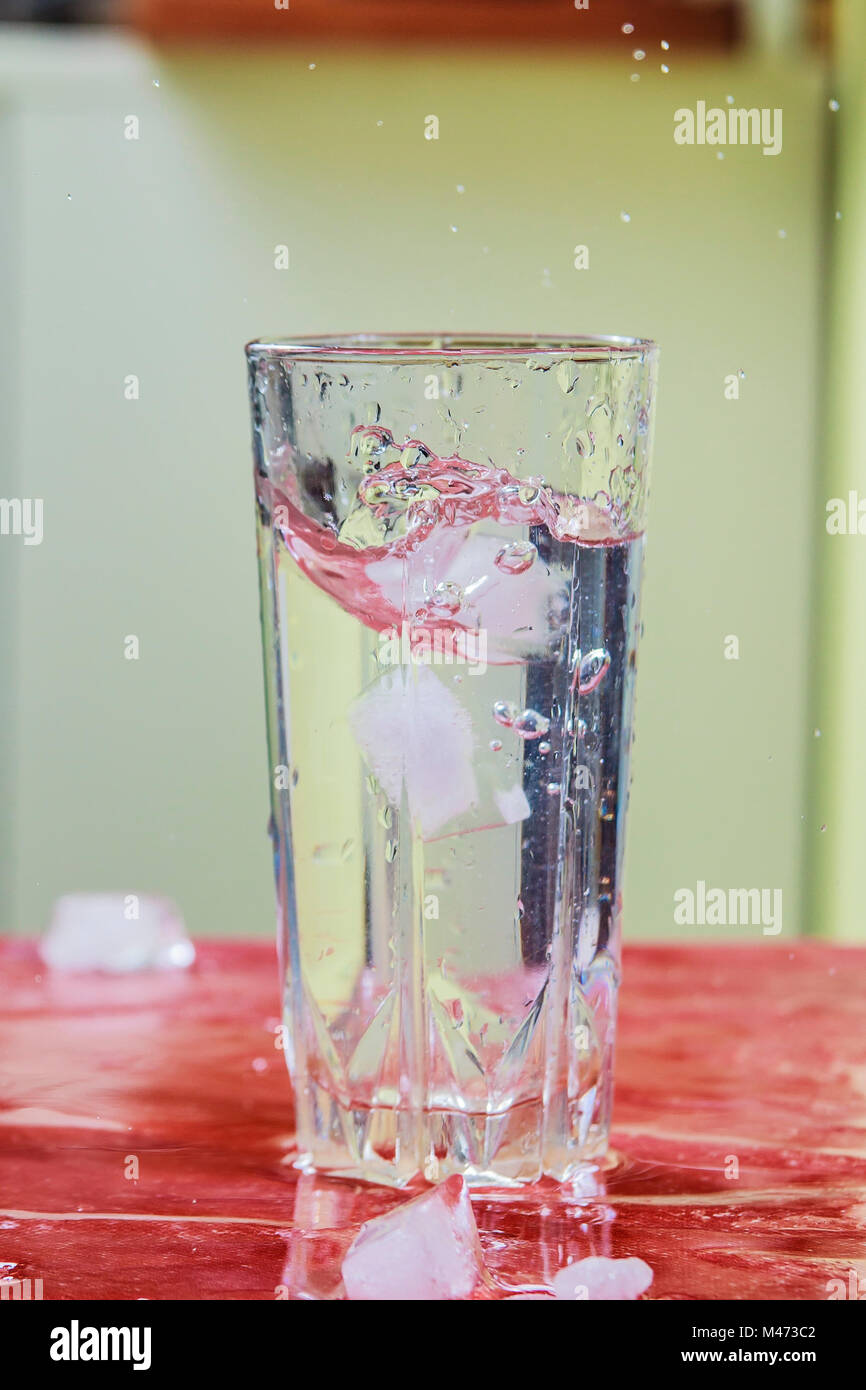 Splash of water in kitchen glass Stock Photo - Alamy