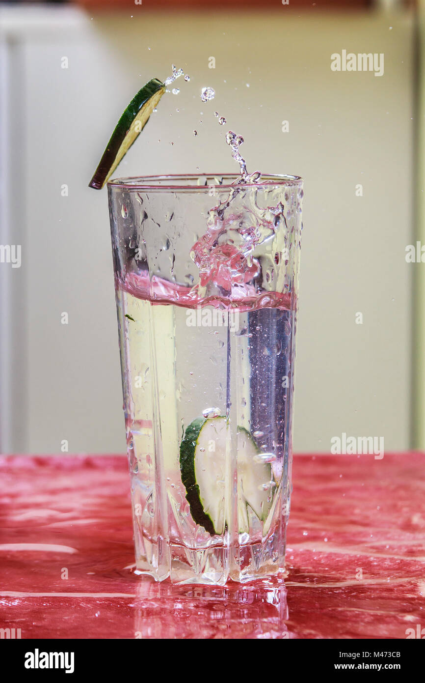 Cucumber splash glass water Stock Photo - Alamy