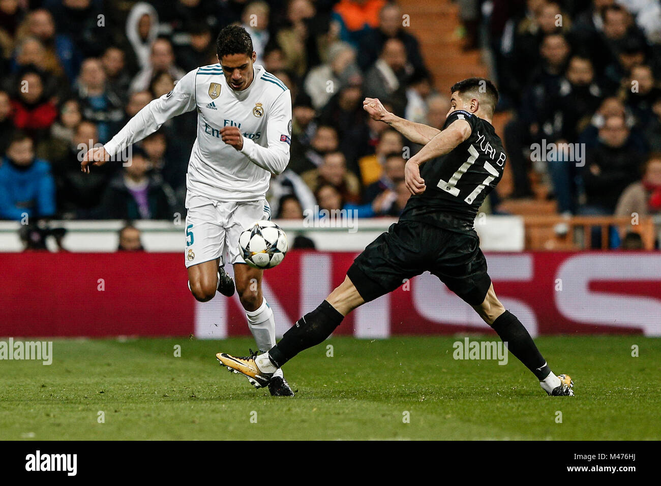 Raphael Varane (Real Madrid) fights for control of the ball with Yuri ...