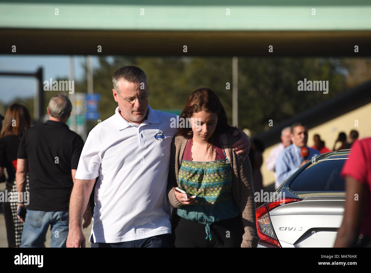 Parkland, Florida, USA. 14th Feb, 2018. People evacuate after a mass ...