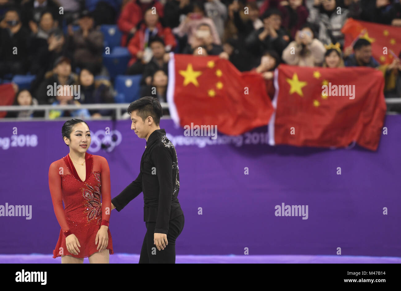 Pyeongchang, South Korea. 15th Feb, 2018. Sui Wenjing (L) and Han Cong of China reacts after the ...