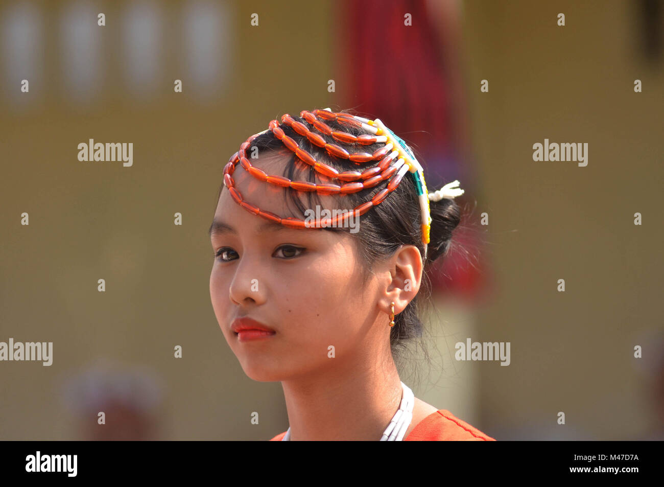Dimapur, Nagaland, India Feb 15, 2018: A Tangkhul girl with traditional ...