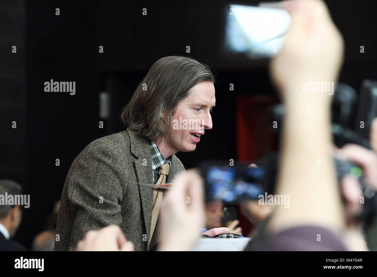 Wes Anderson, director and screenwriter, gives autographs during the ... Wes Anderson, director and screenwriter, gives autographs during the ...