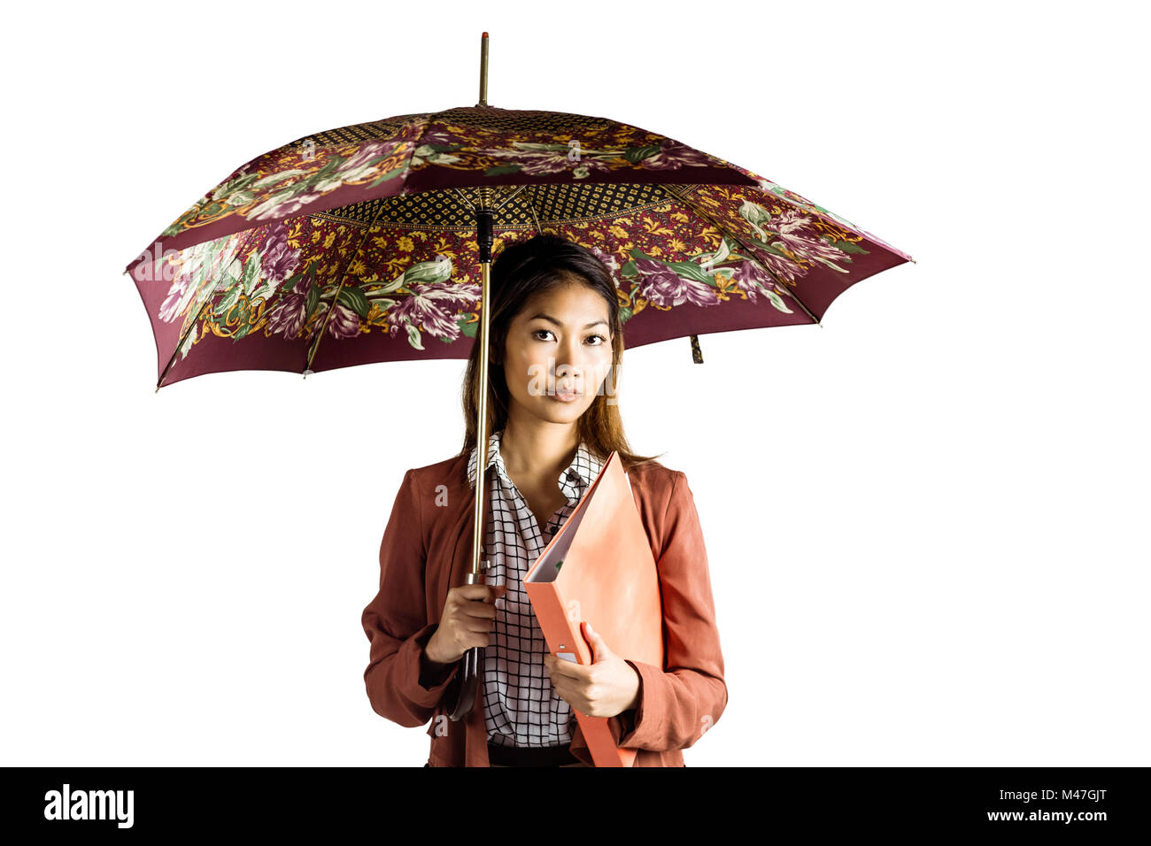 Businesswoman with an umbrella holding a binder Stock Photo - Alamy
