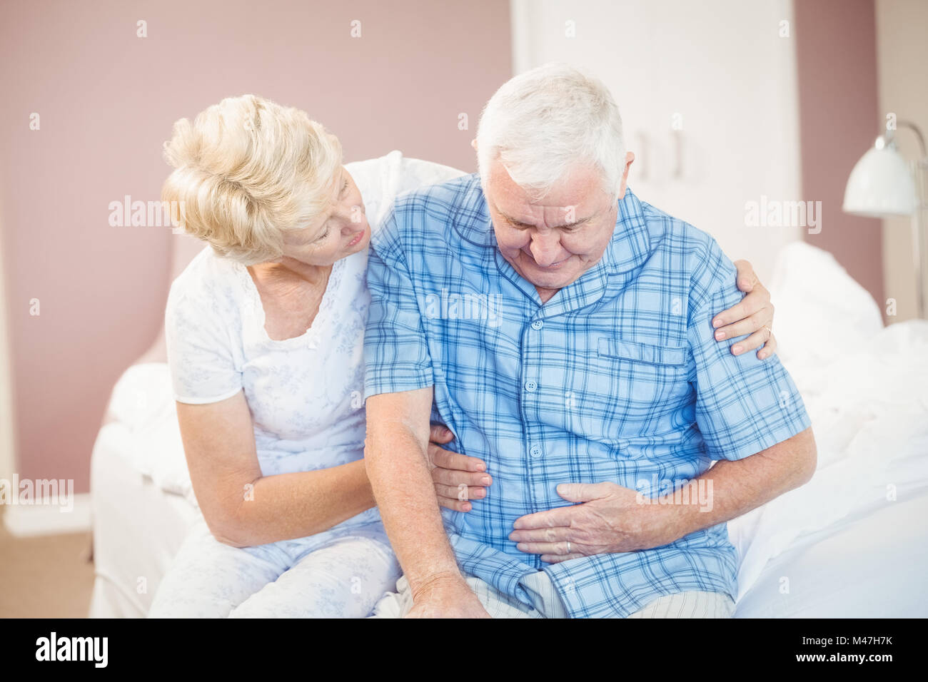 Husband comforting wife hi-res stock photography and images - Alamy