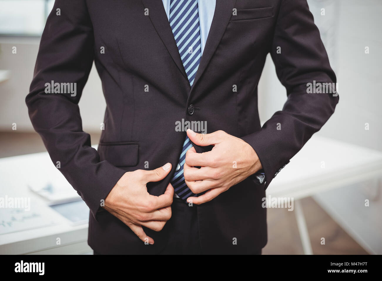 Professional man in suit adjusting hi-res stock photography and images ...