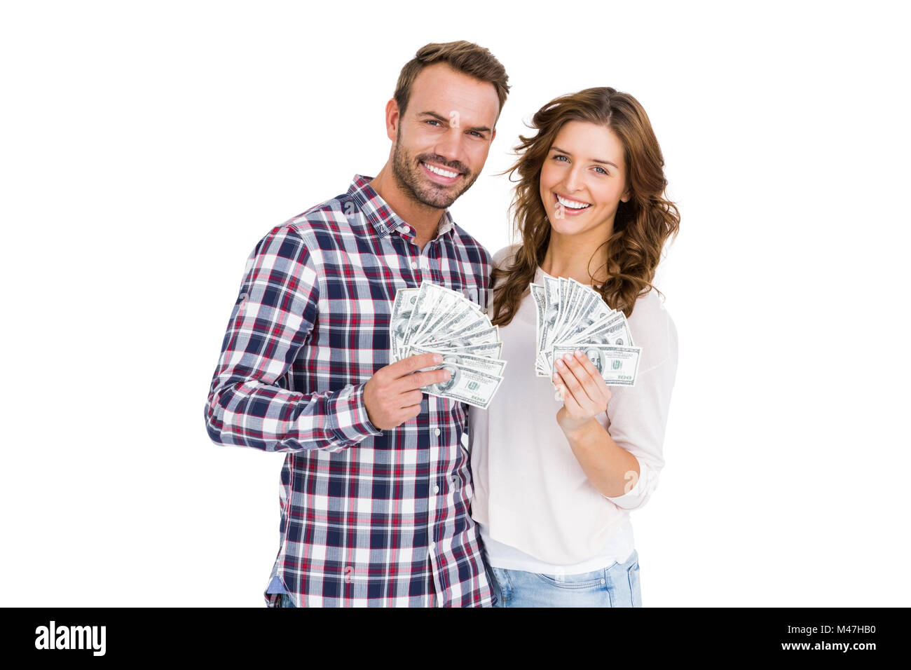 Happy young couple holding fanned out currency notes Stock Photo - Alamy