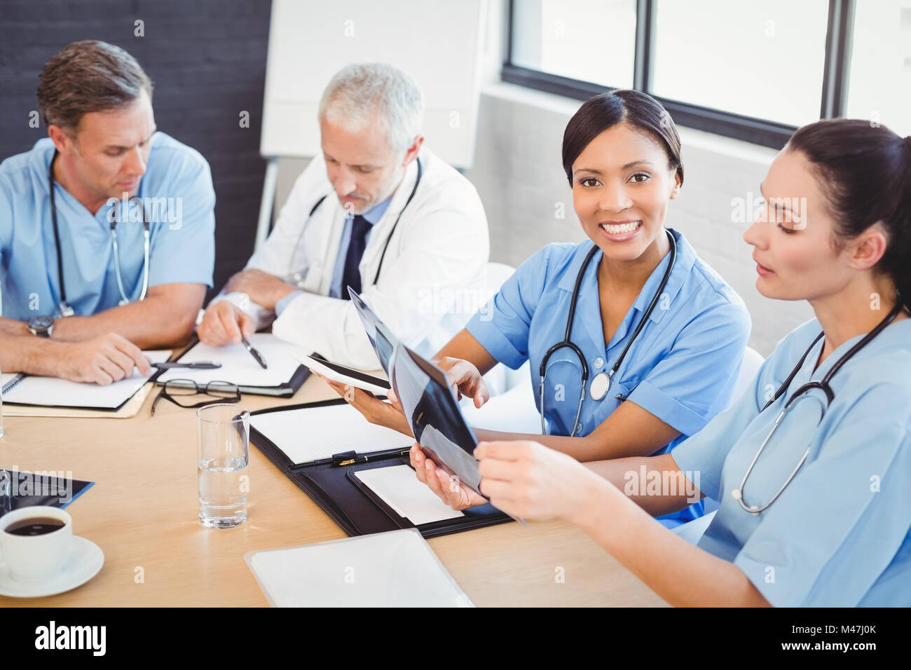 Portrait of female doctor smiling in conference room Stock Photo - Alamy