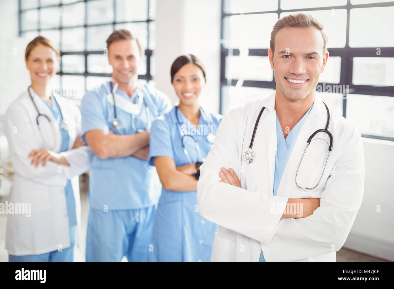 Portrait of medical team standing together with arms crossed Stock ...