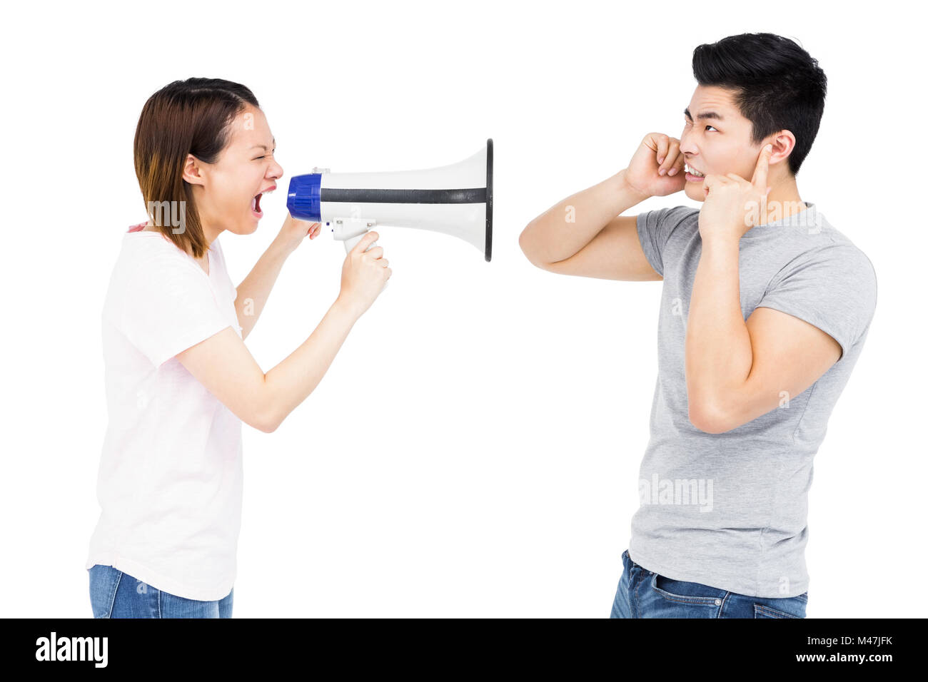 Angry woman shouting at young man on horn loudspeaker Stock Photo - Alamy