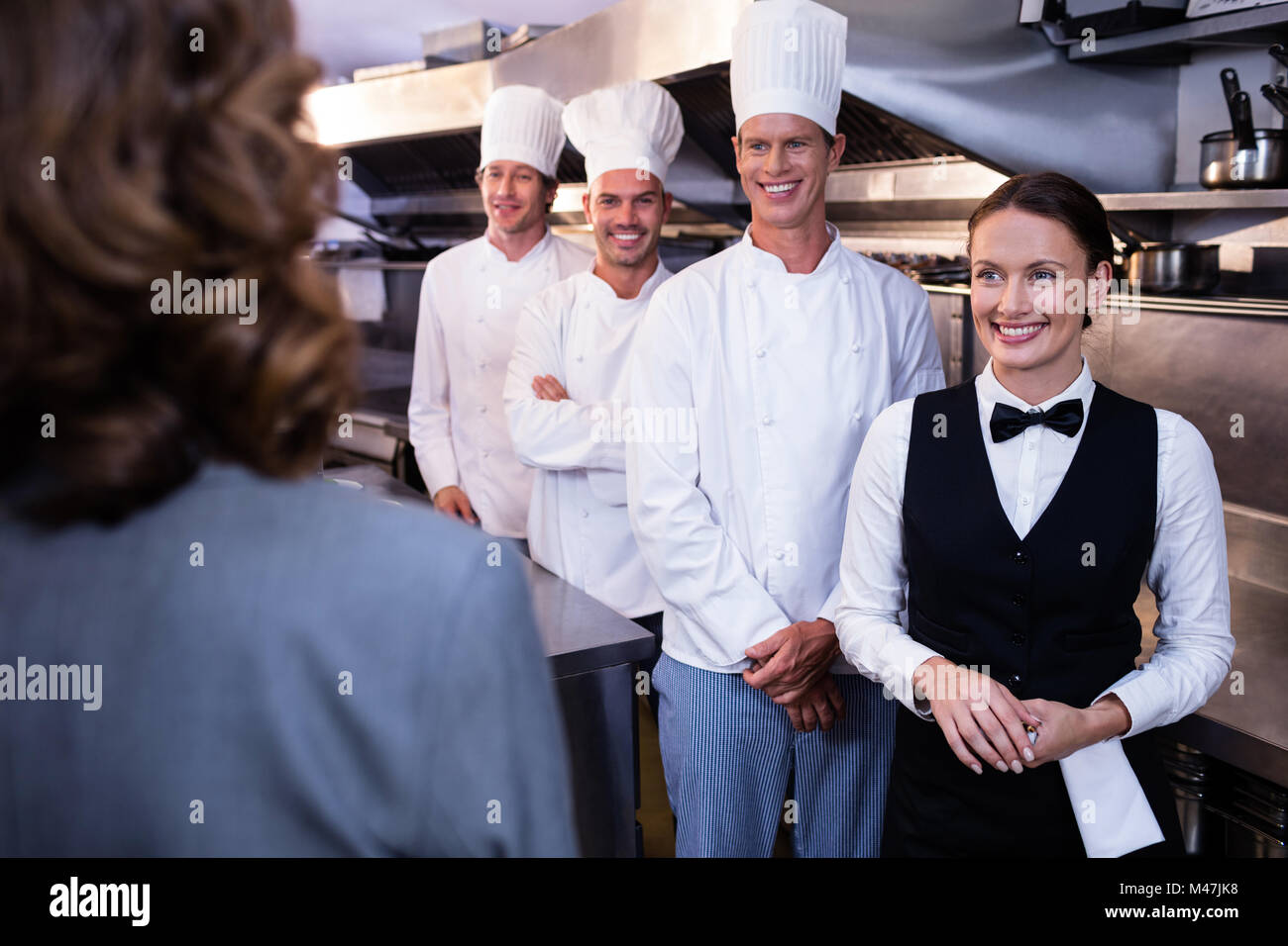 Restaurant manager briefing to his kitchen staff Stock Photo - Alamy