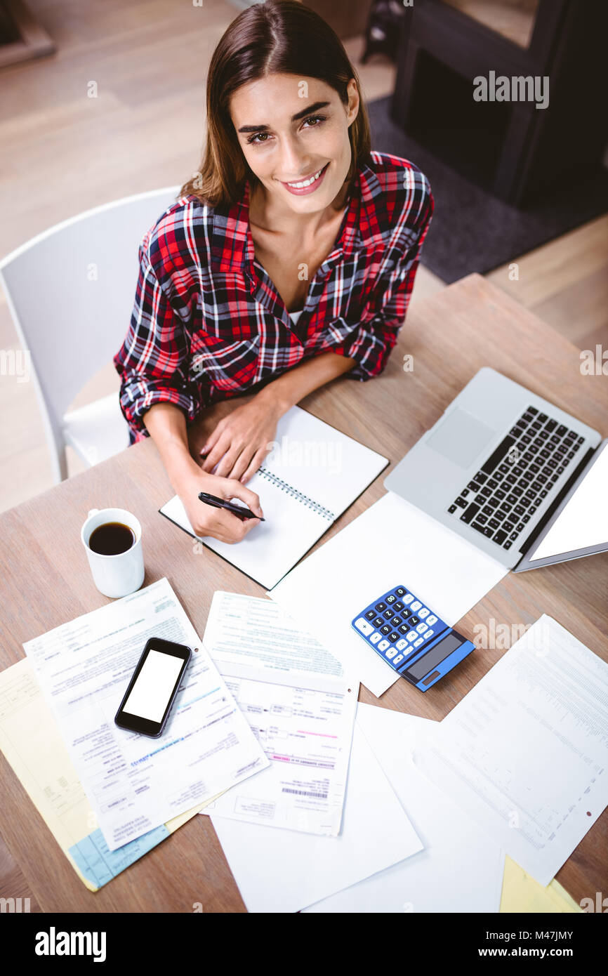 High angle portrait of happy woman writing in notepad Stock Photo - Alamy