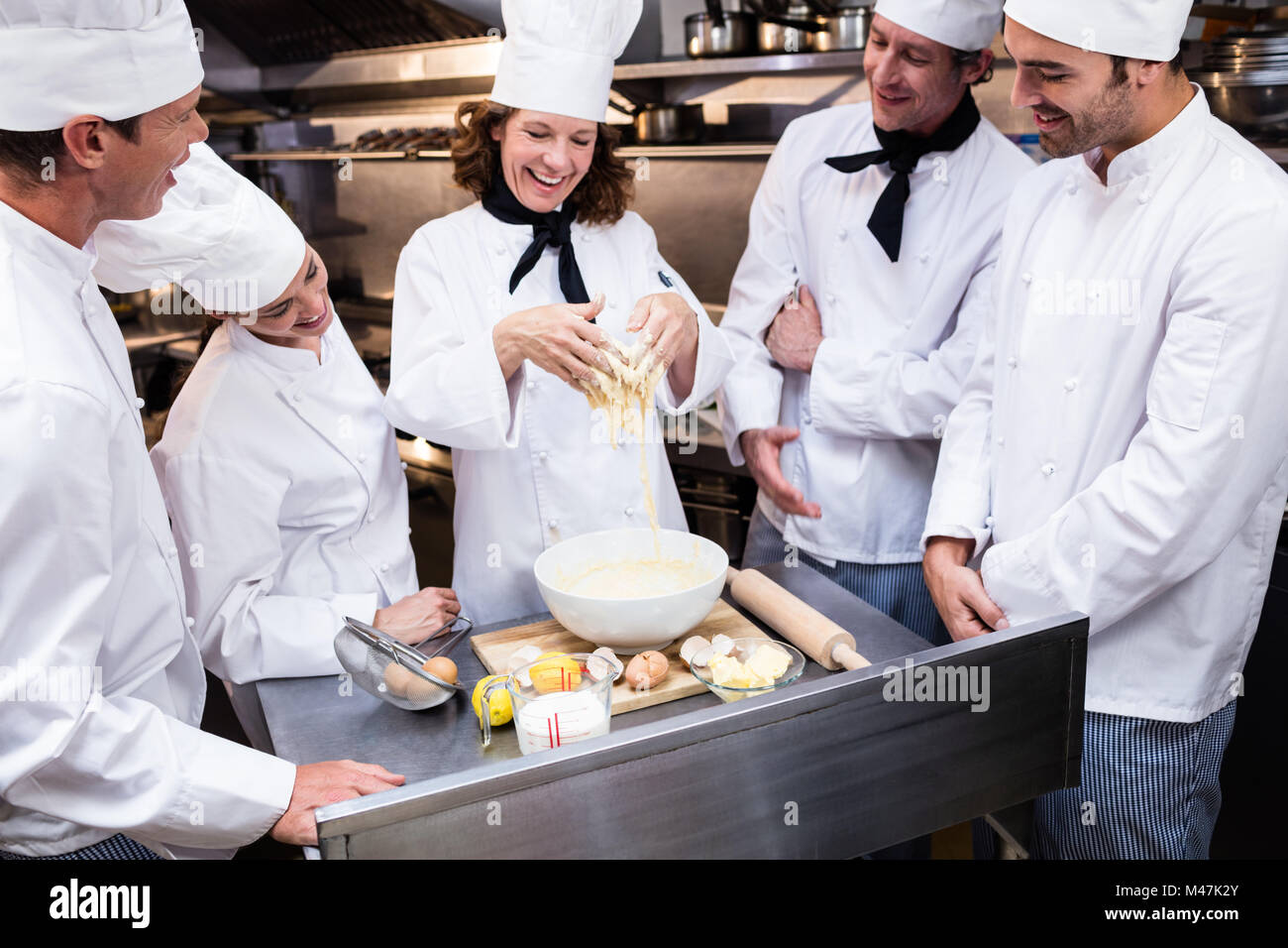 Smiling pastry chefs team hi-res stock photography and images - Alamy