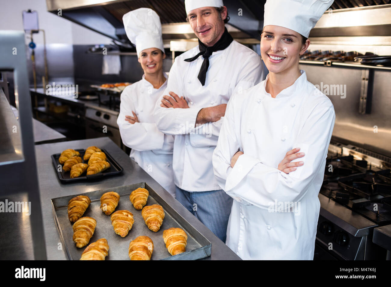 Portrait of three chefs in commercial kitchen Stock Photo - Alamy