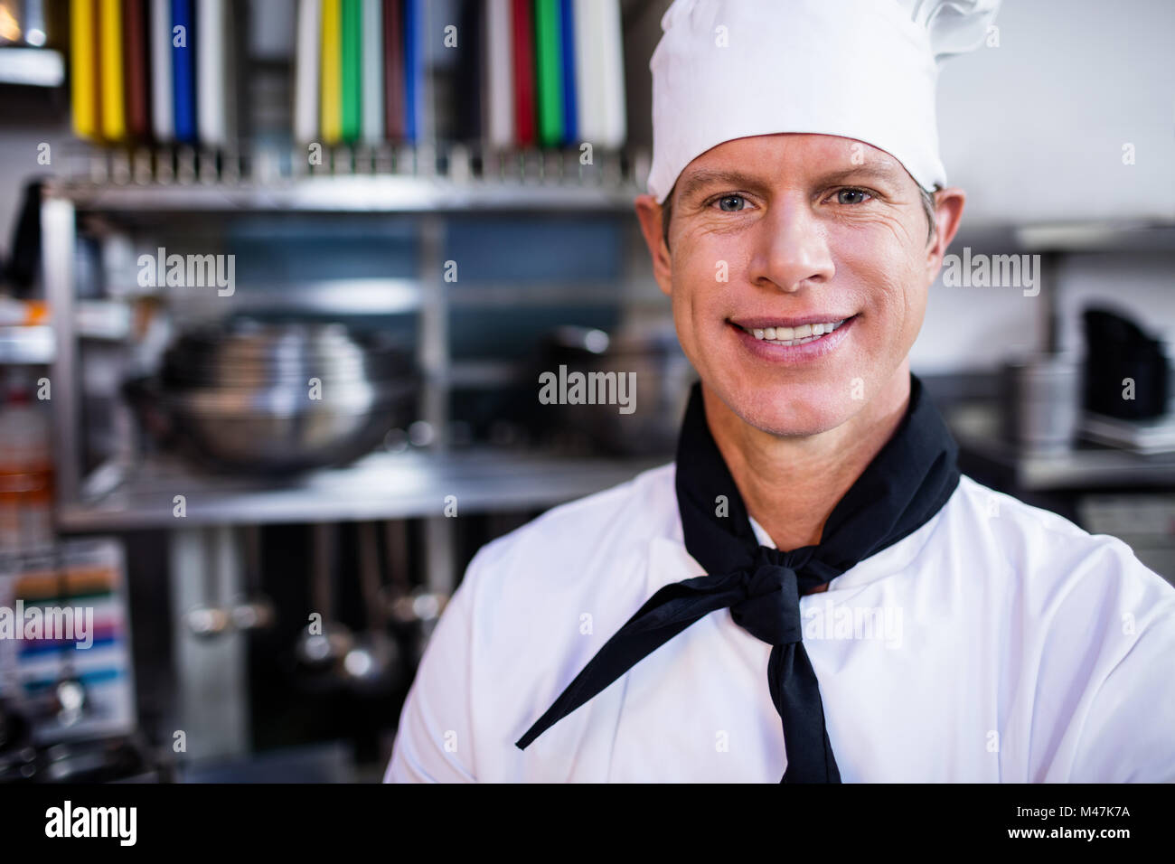 Portrait of smiling chef in commercial kitchen Stock Photo - Alamy