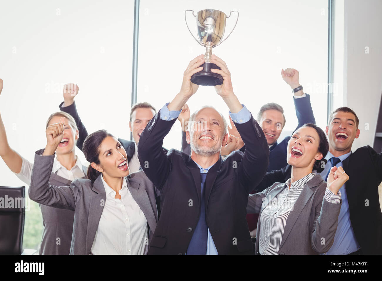 Executive team holding corporate hi-res stock photography and images ...