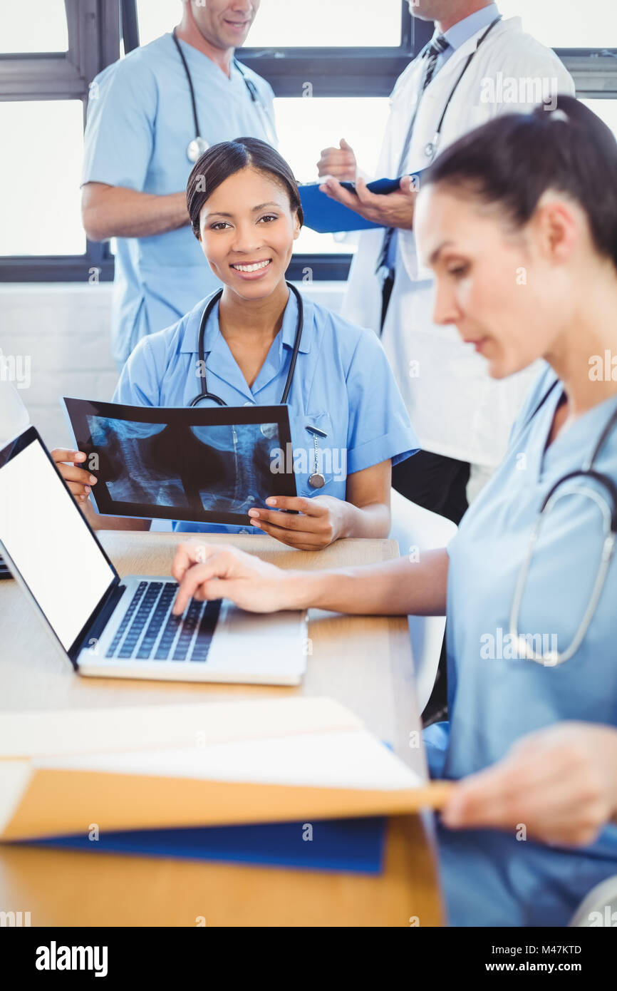 Doctor holding a x-ray report in conference room Stock Photo - Alamy