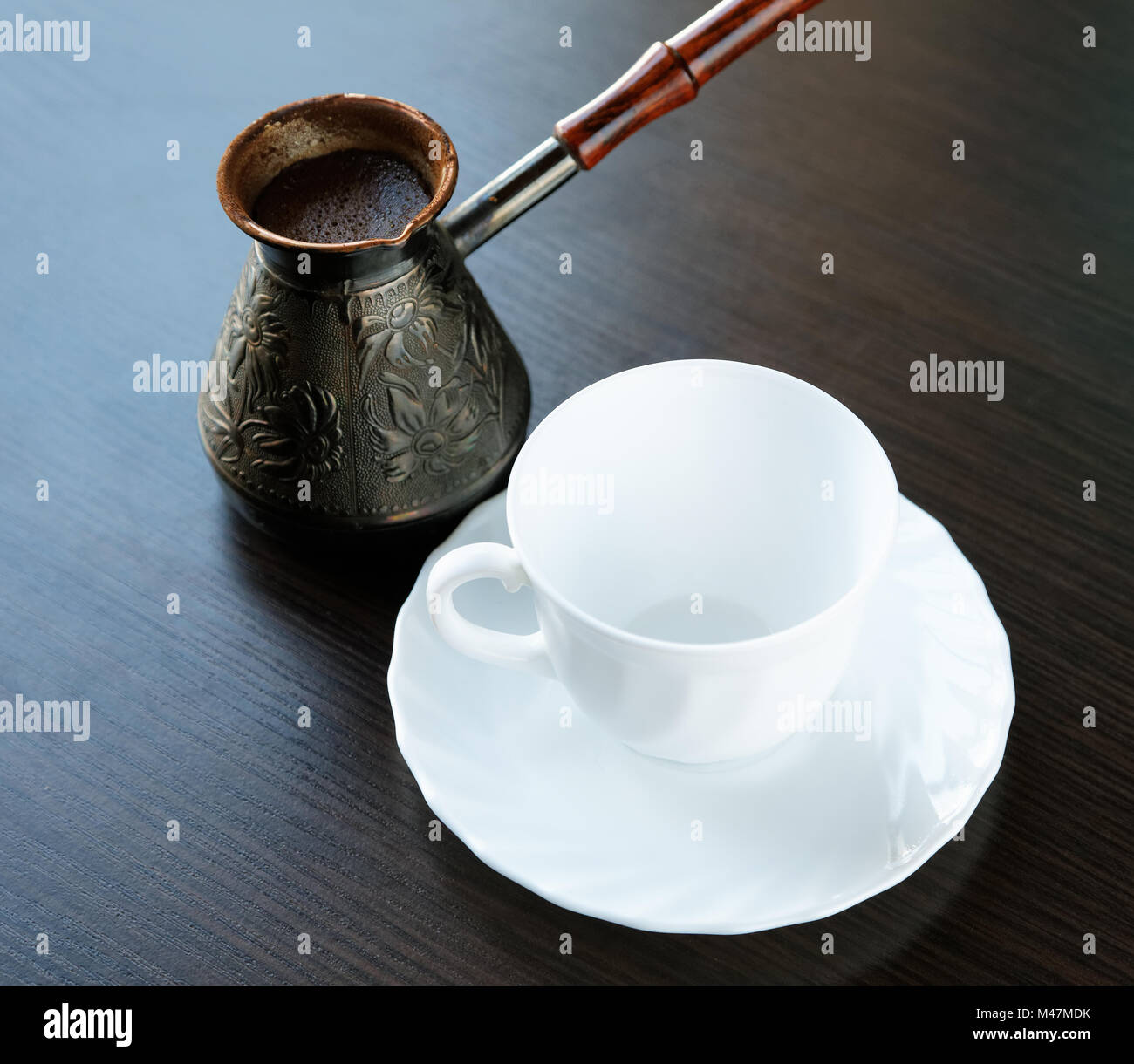 coffee maker with coffee and white cup on the table Stock Photo - Alamy