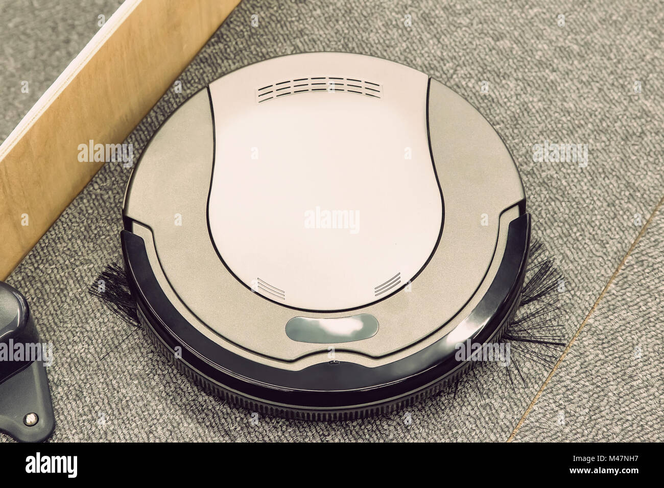Robotics - the automated robot the vacuum cleaner Stock Photo - Alamy