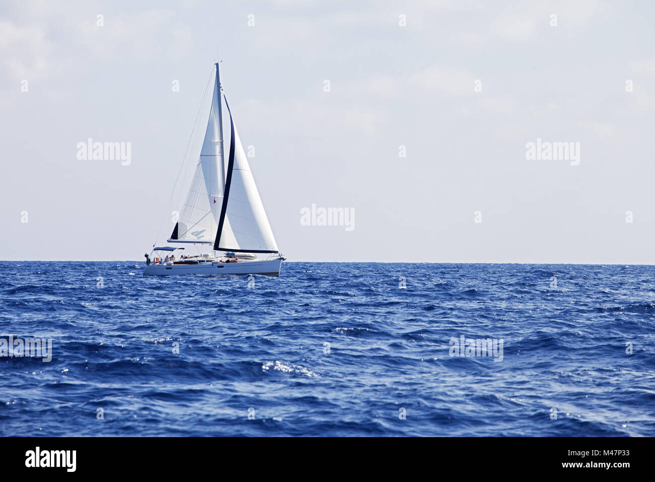 Yacht with white sails Stock Photo - Alamy