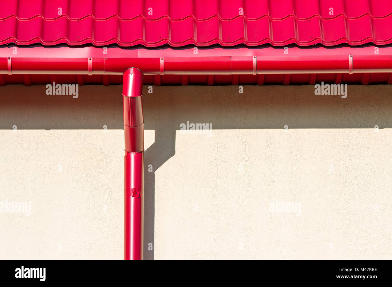 new rain water downspout on wall Stock Photo - Alamy
