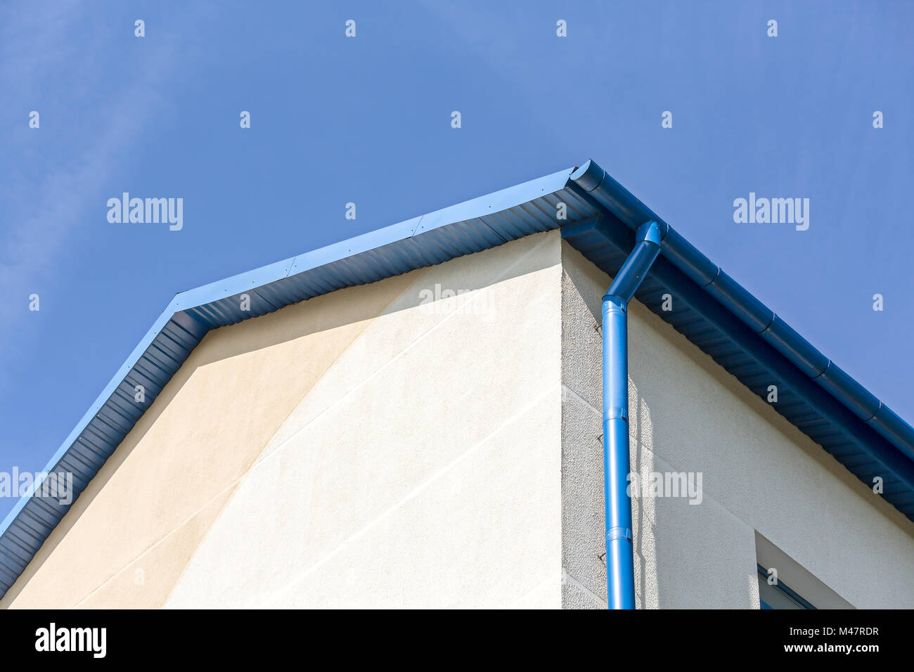 blue rain gutter system Stock Photo - Alamy