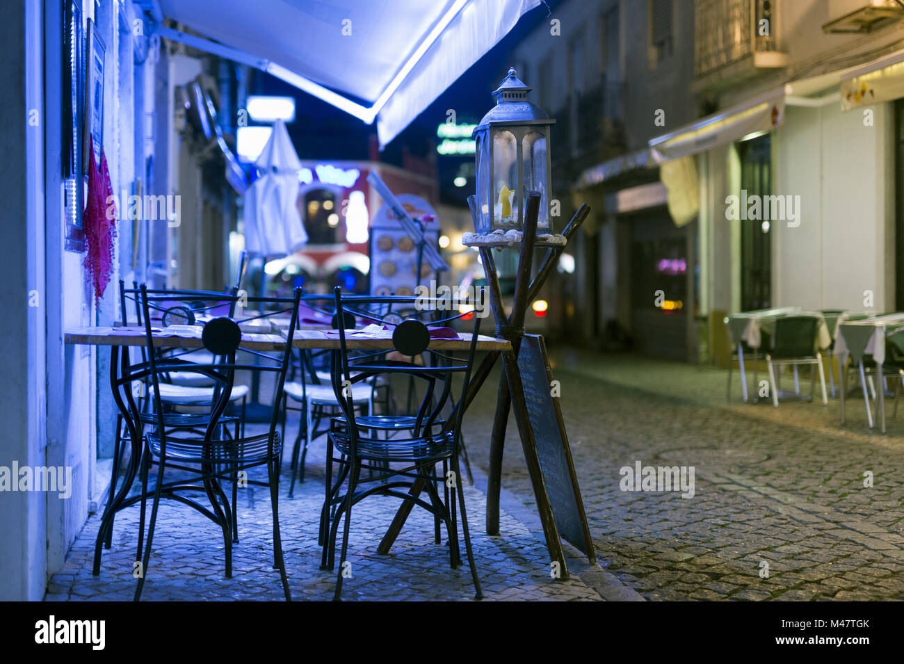 Night shot. People Empty restaurant in Old Town Stock Photo - Alamy