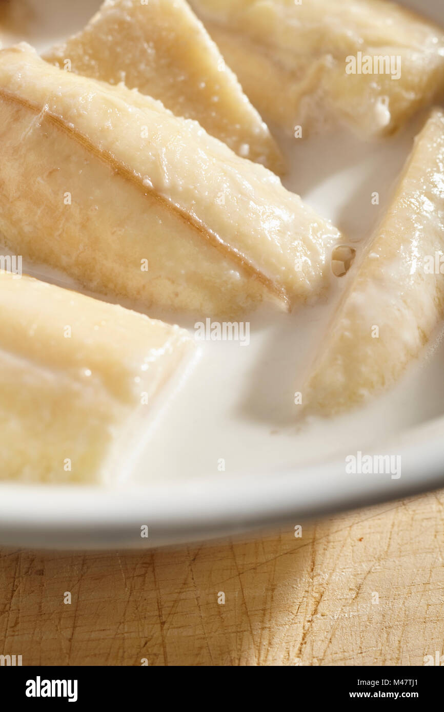 Bananas cooked in coconut milk, a Thai classic sweet Stock Photo - Alamy