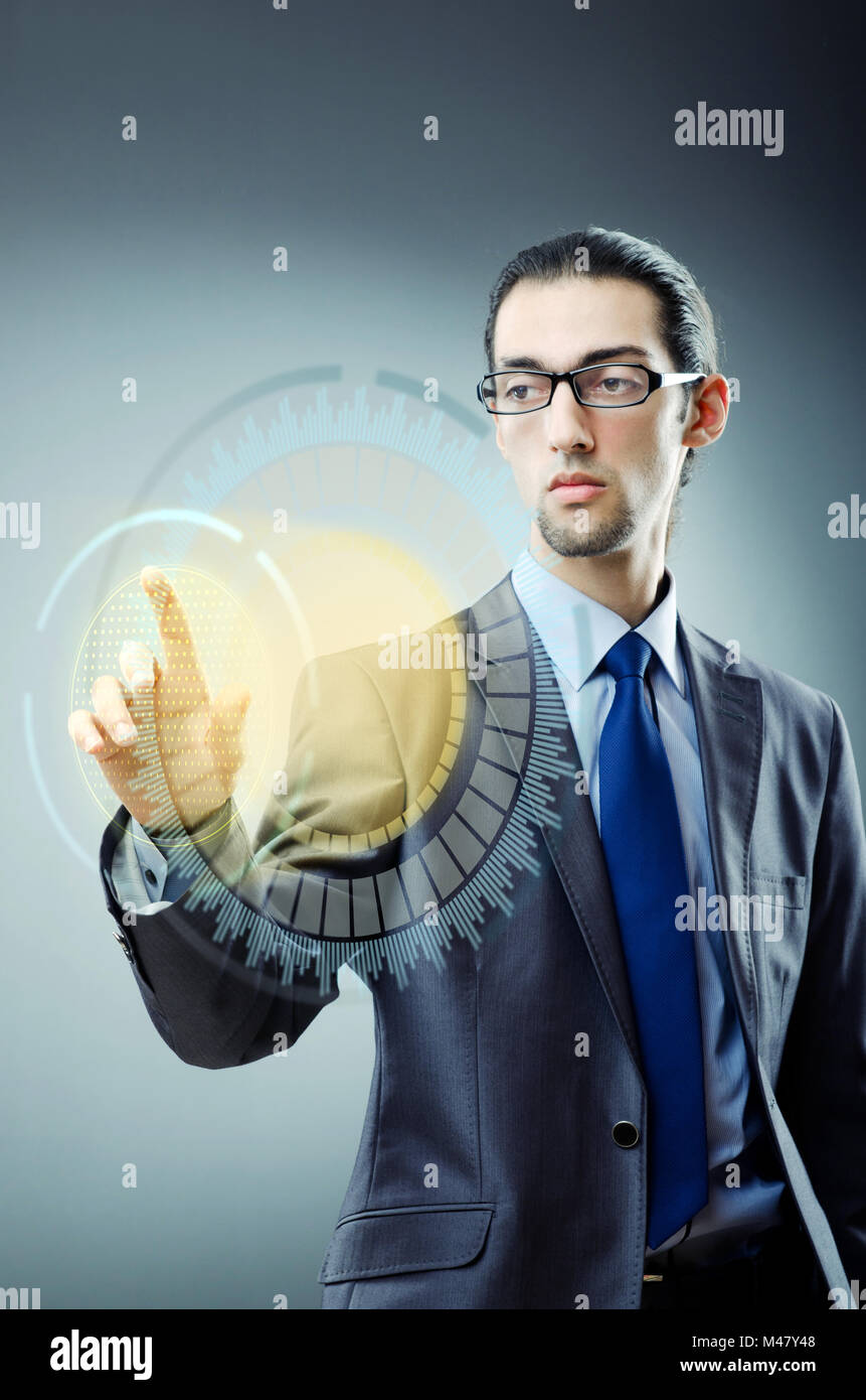 Businessman pressing virtual buttons in futuristic concept Stock Photo ...