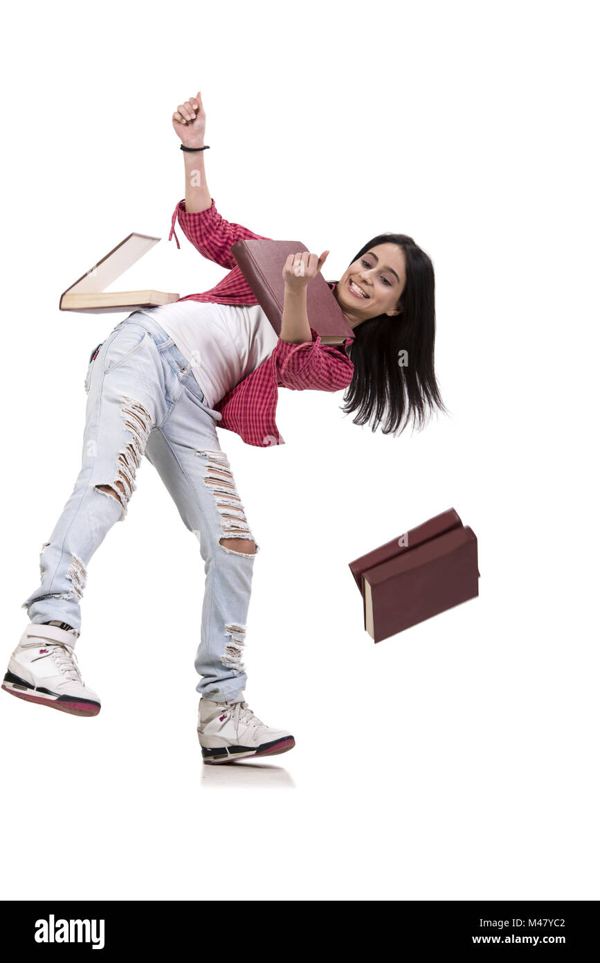 Woman throwing books hi-res stock photography and images - Alamy