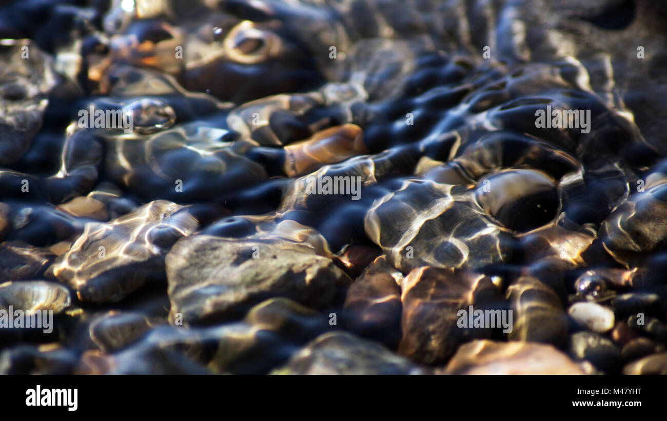 Pebbles in stream hi-res stock photography and images - Alamy