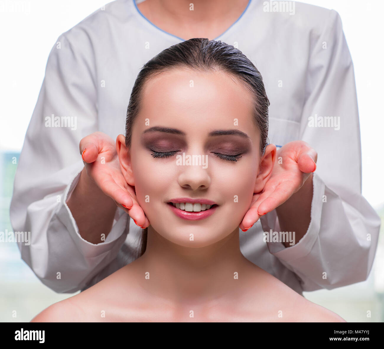 Young woman during face and skin massage session Stock Photo - Alamy