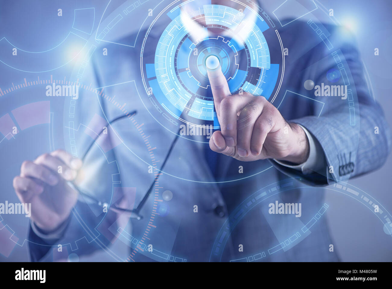 Businessman pressing virtual buttons in futuristic concept Stock Photo ...