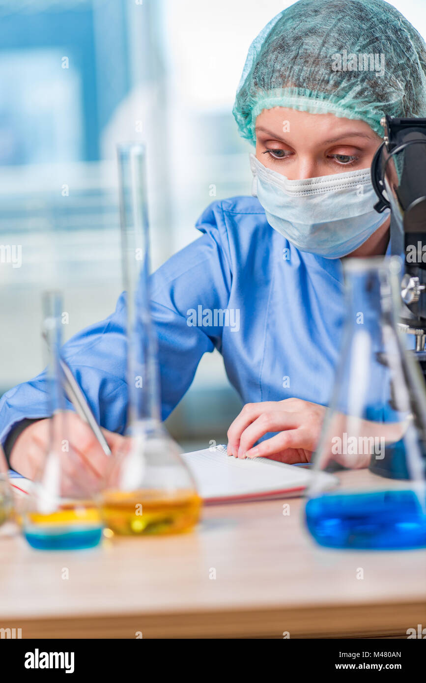 Experienced lab assistant working on chemical solutions Stock Photo - Alamy