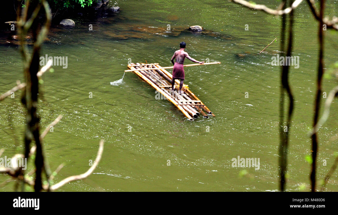 a tribe is doing fishing,bambooraft is boat in the forest and tribe ...