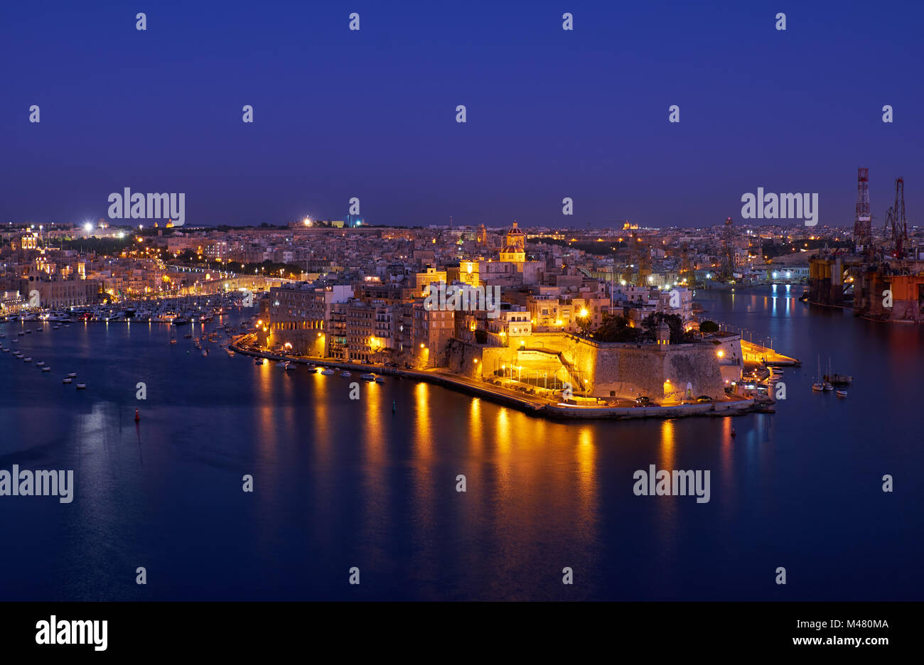 The night view of Senglea peninsula from Valletta, Malta Stock Photo ...