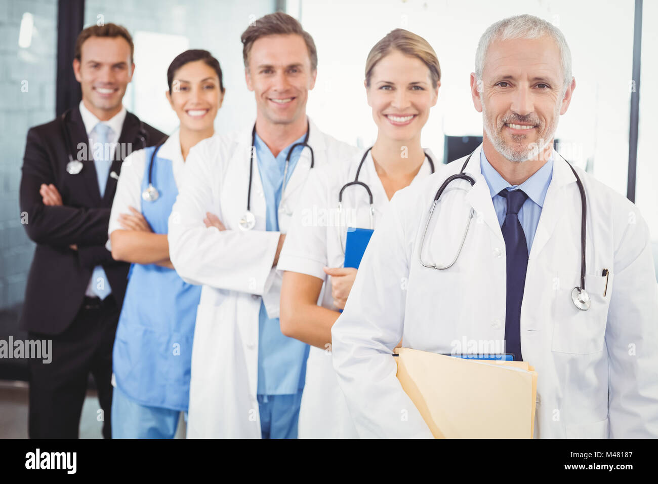 Happy medical team arms crossed hi-res stock photography and images - Alamy