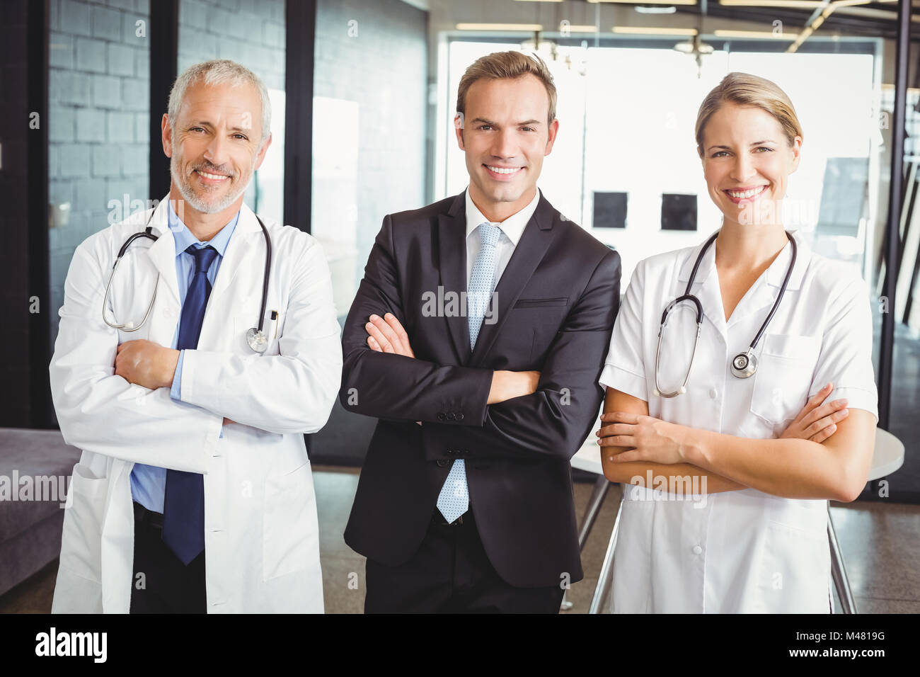 Happy medical team arms crossed hi-res stock photography and images - Alamy