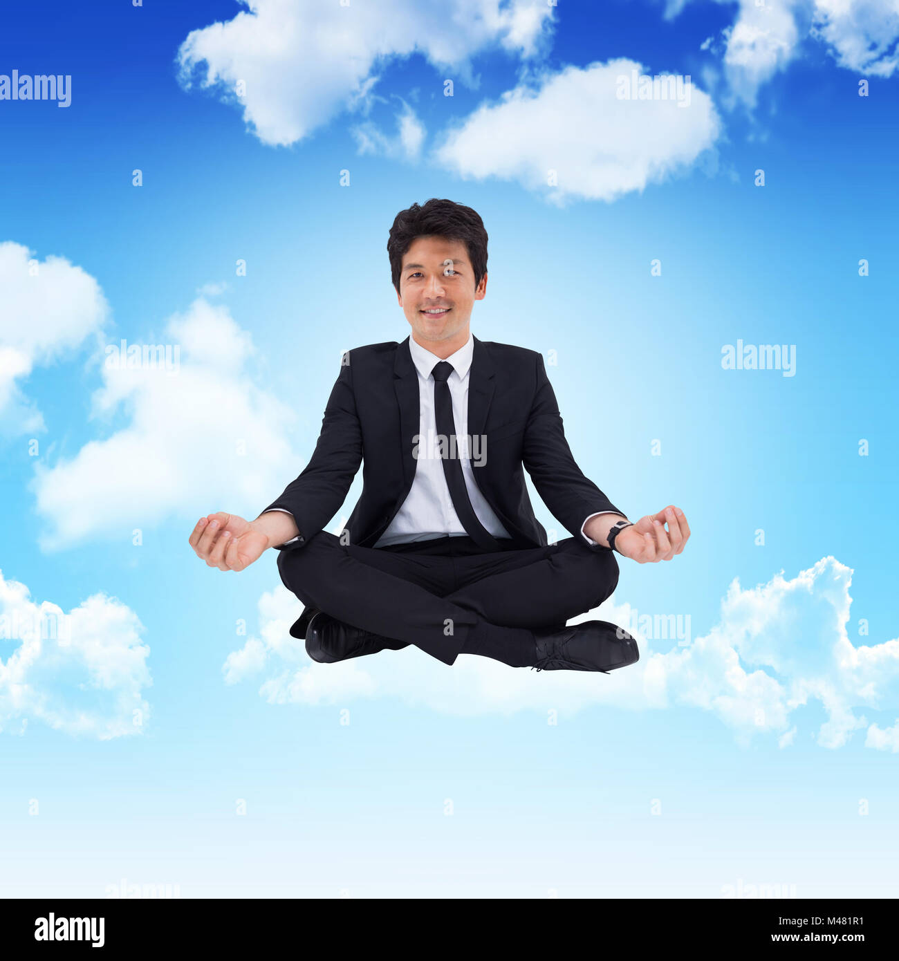 Composite image of businessman sitting with meditation gesture Stock ...
