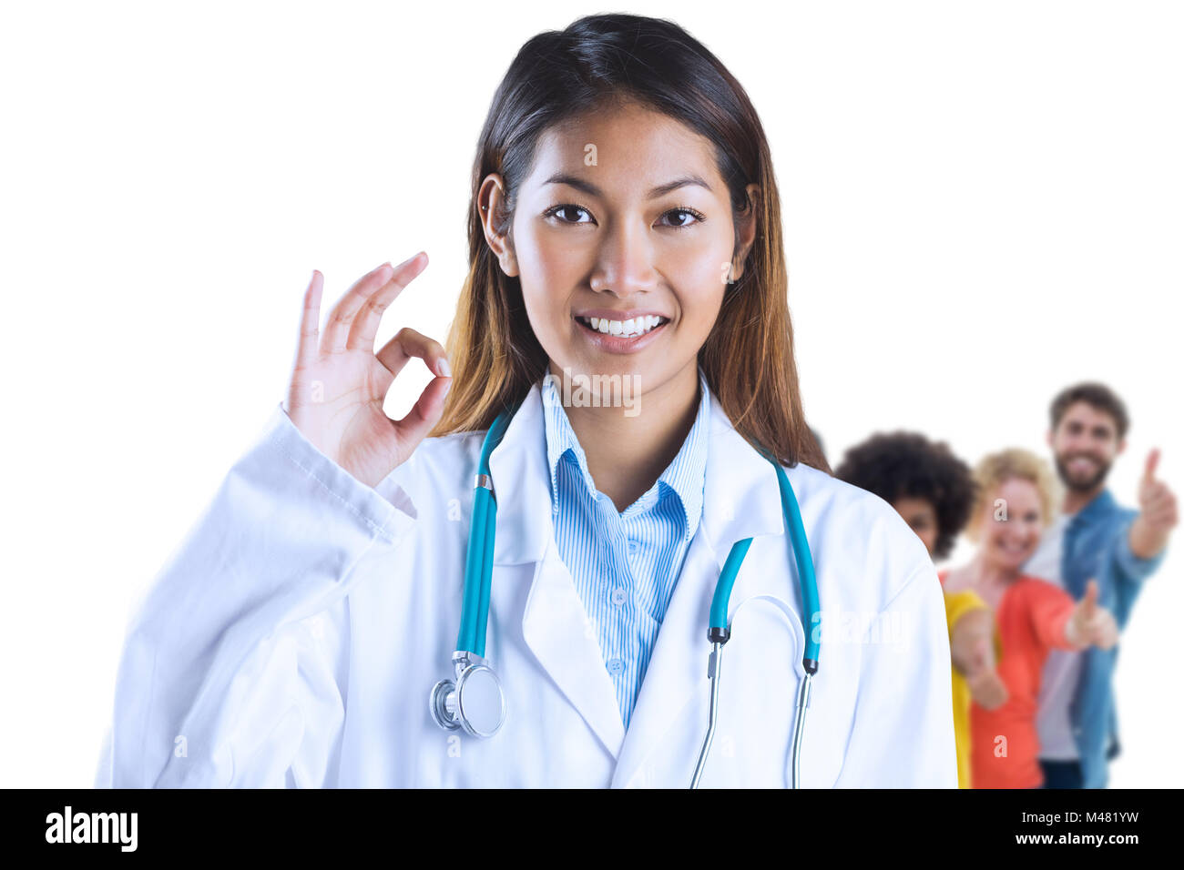 Composite image of asian doctor doing ok sign Stock Photo - Alamy