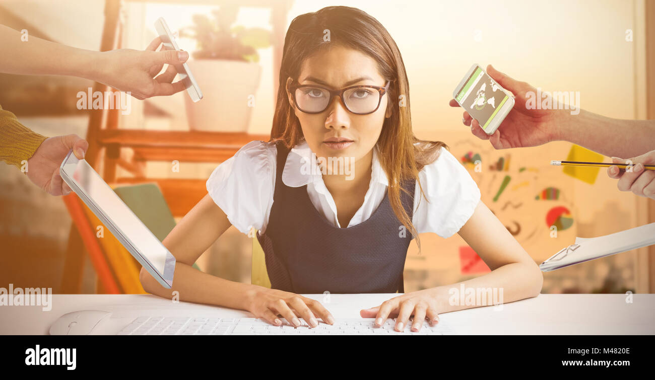 Composite image of hands holding devices Stock Photo - Alamy