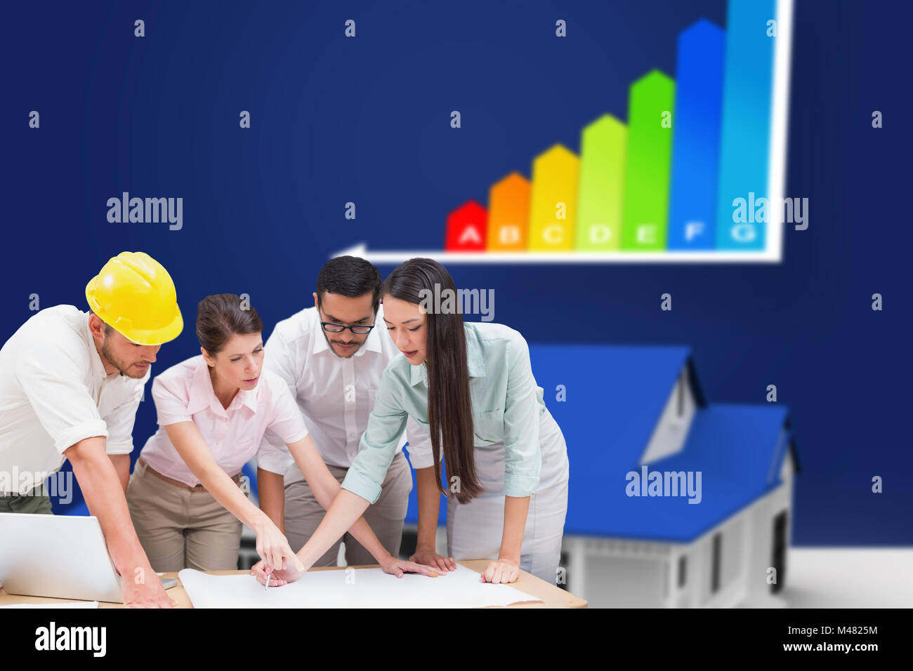 Composite image of architecture team working together at desk Stock ...