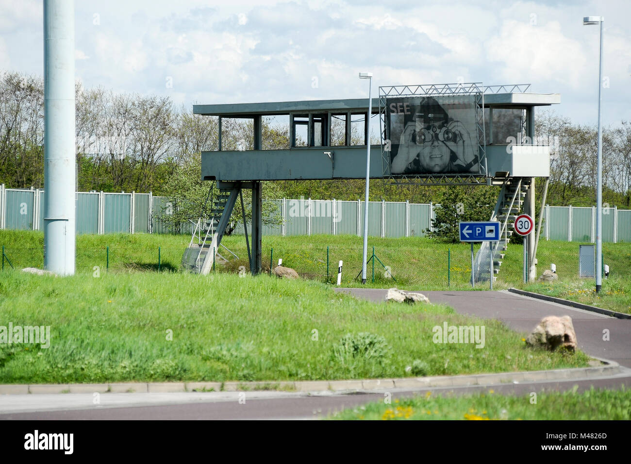 Observation bridge with picture of GDR border guard See you in former ...