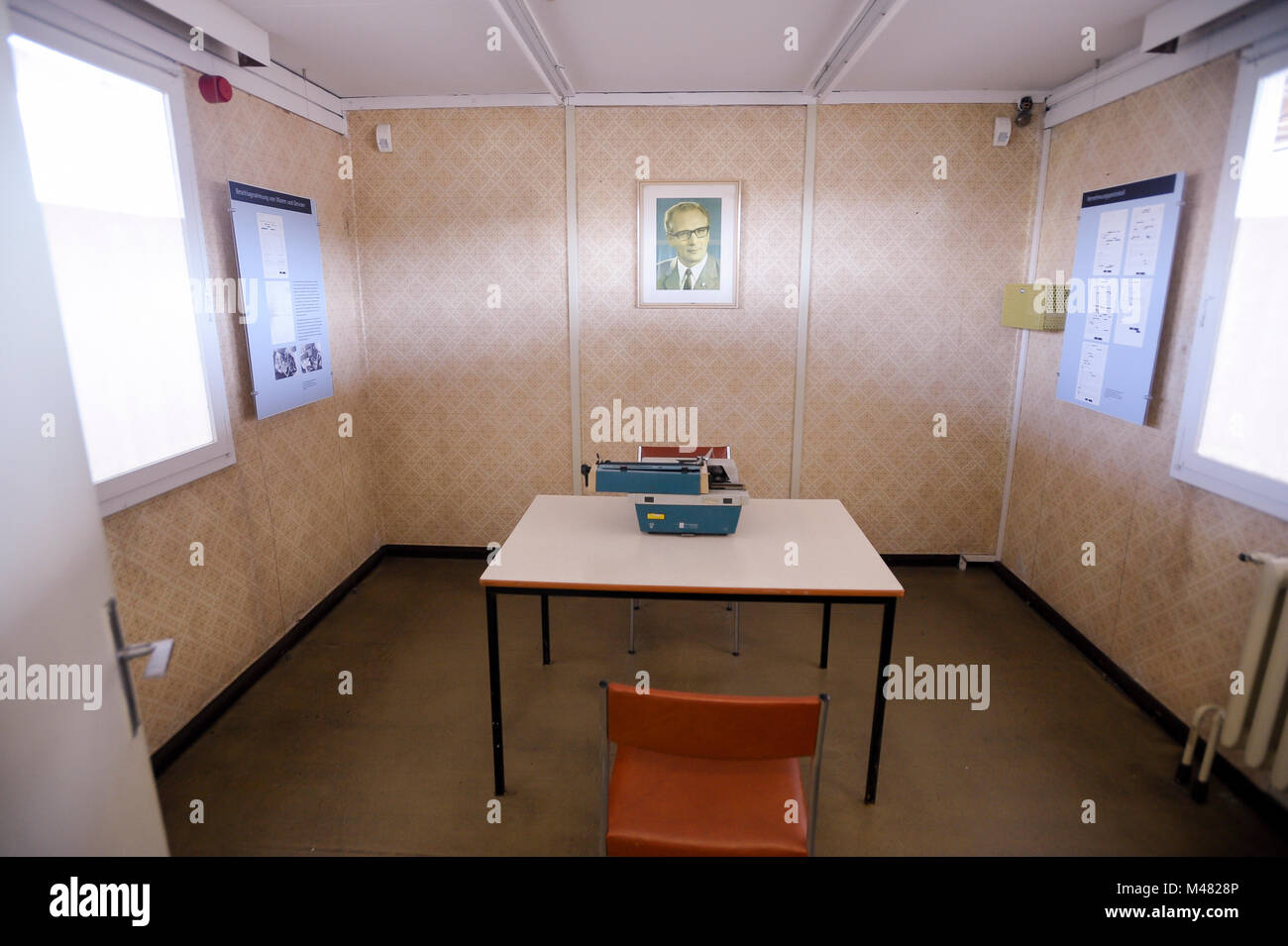 Exhibition of interrogation room with typewriter on the table and ...